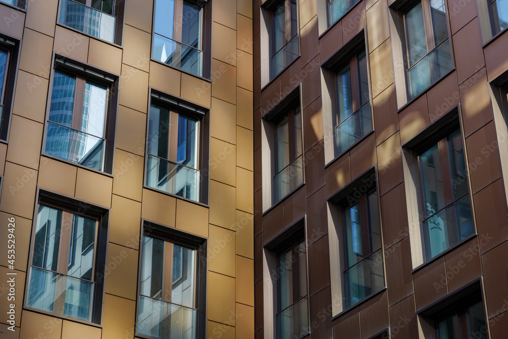 Exterior architectural detail modern golden facade of High-rise office ...