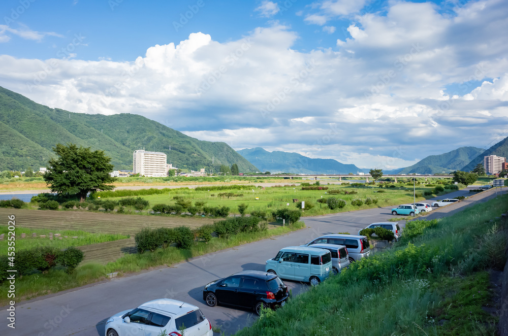 summer scenery of the countryside, chikuma river, mountains, and ...