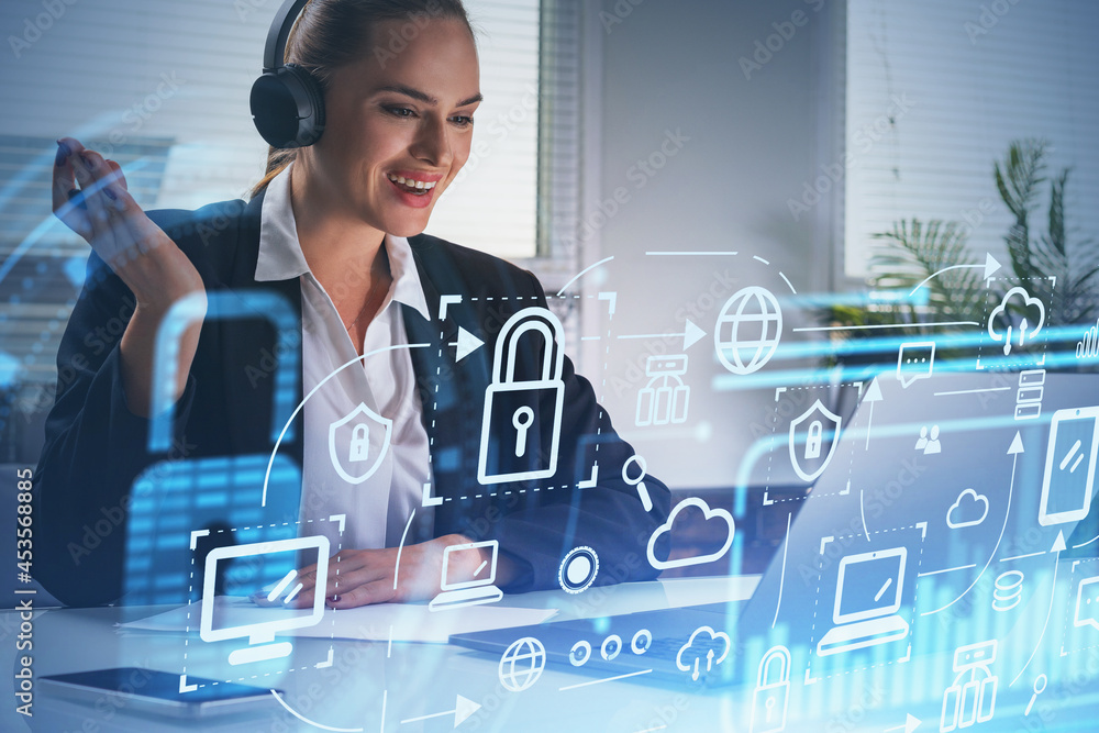 Businesswoman wearing formal suit is sitting at workplace in front of ...