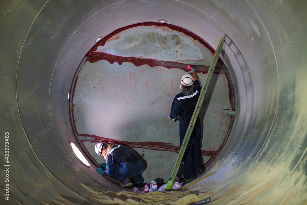 Working male two inspection weld PT test weldment for finding defect ...