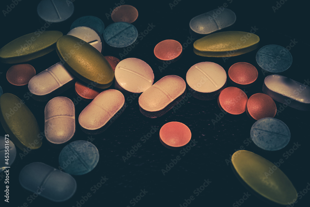 Pharmaceutical medicine pills in both tablets and capsules with the ...