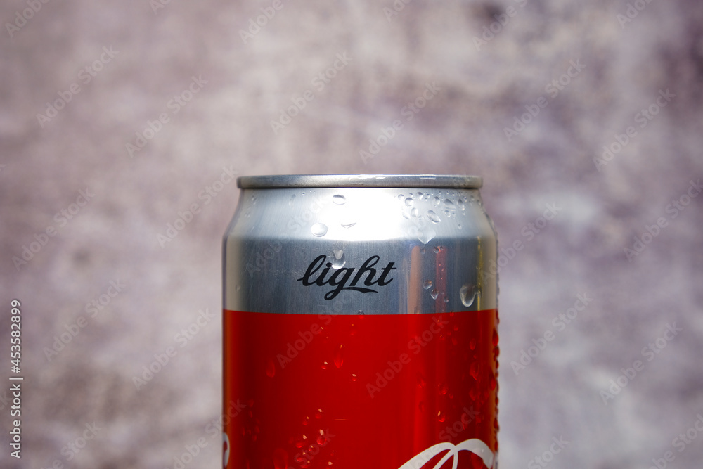 A picture of light word at soft drink can with crack background insight ...