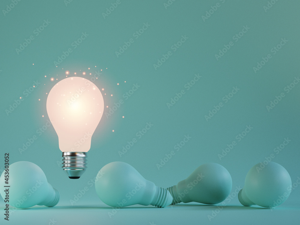 One of Lightbulb glowing among shutdown light bulb in dark area with ...