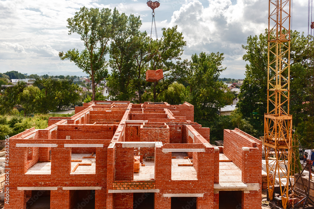 Building site, construction site with brick houses, building materials ...