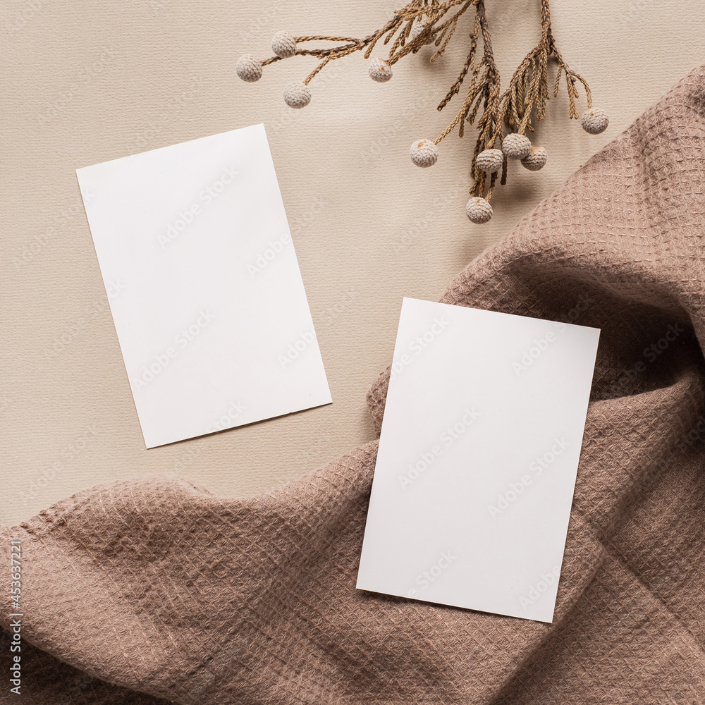 Blank paper sheet card with mockup copy space and dry floral branch and ...
