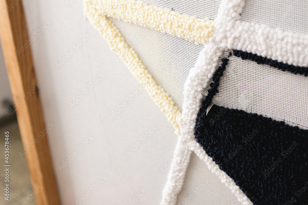 Needle of rug tufting gun and threads of canvas Stock Photo | Adobe Stock