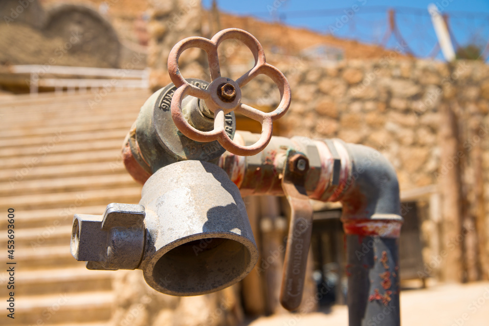 Fire safety in a country with a hot climate. Fire hydrant pipe with red ...