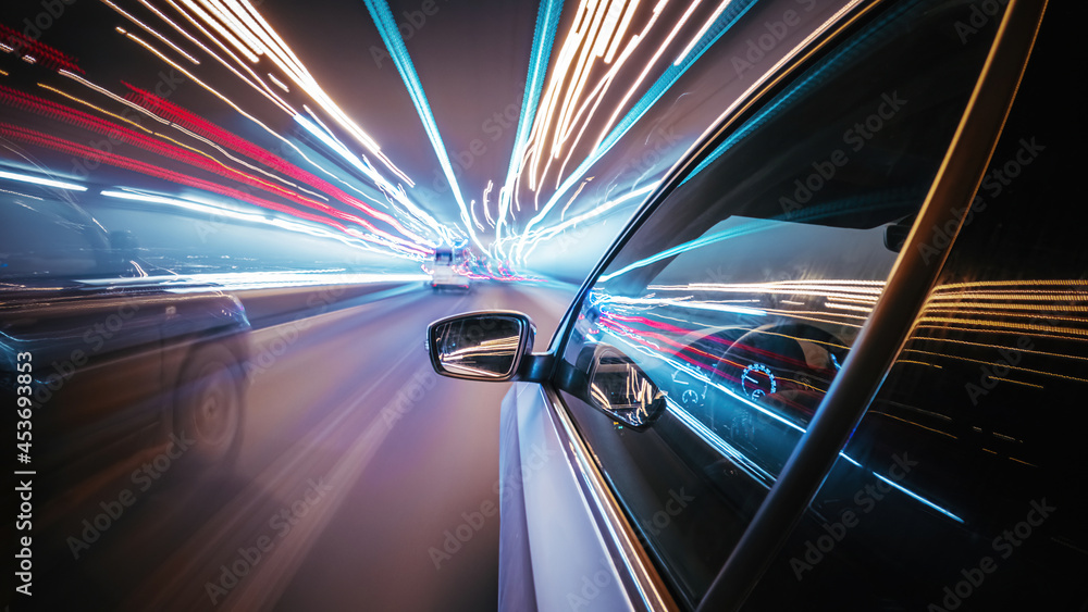 Speedy night drive in a big city ending in the underground car parking ...