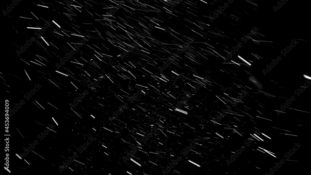 Heavy snow falling from left to right on the black background. Severe ...