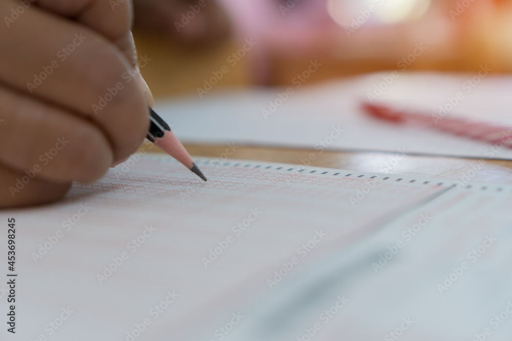 School Student hands taking exams, writing examination holding pencil ...