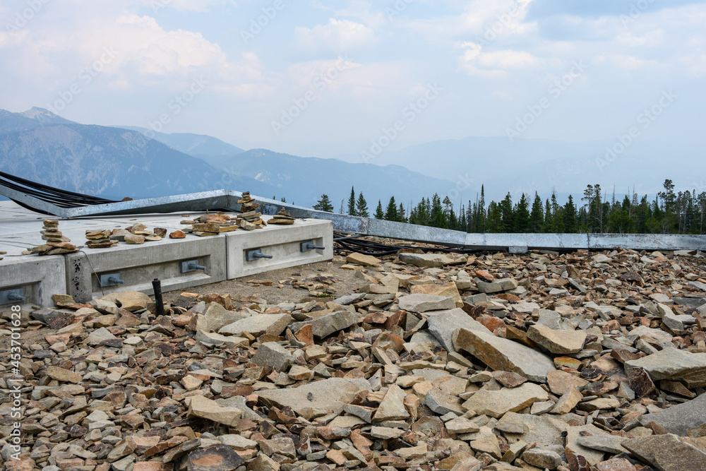 Cell site foundation and cable tray on mountain peak with a smokey view ...