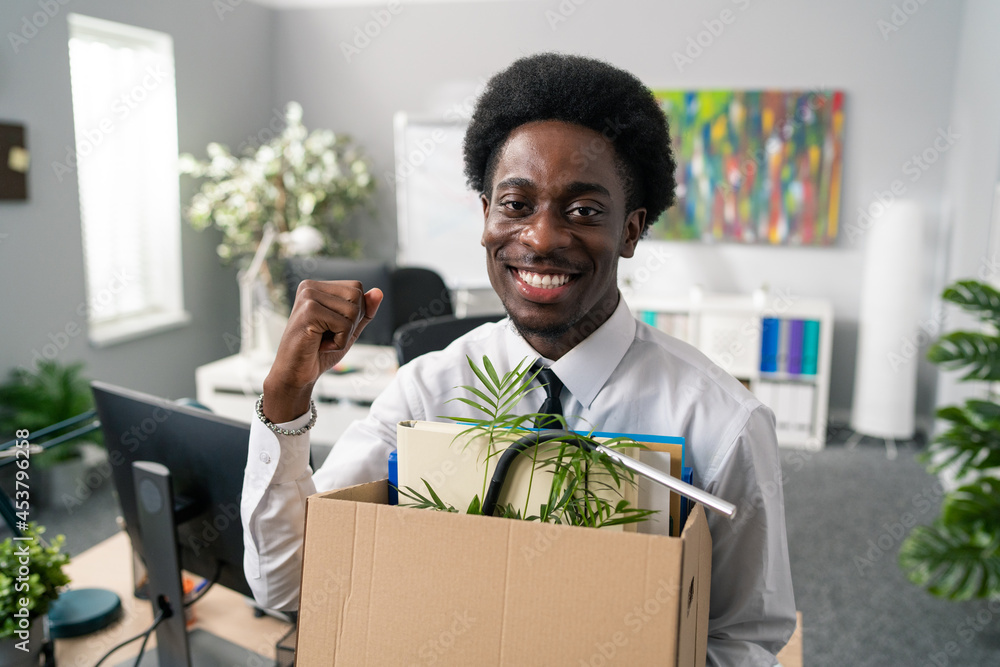 Dark-skinned man with afro hair quits company job walks out of office ...