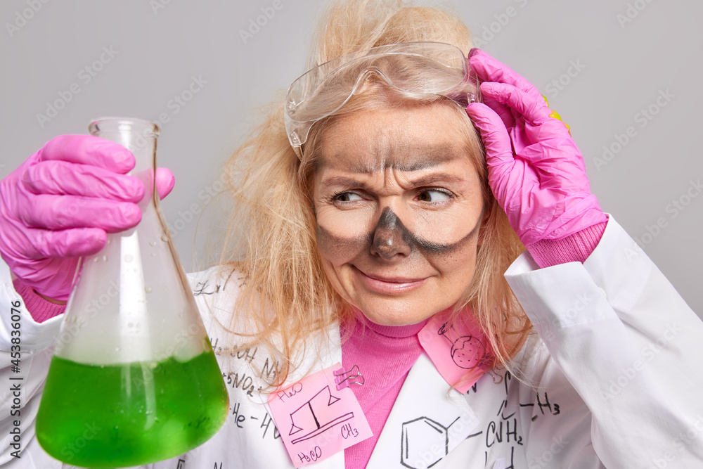 Scientific discovery and chemisty concept. Serious female chemist looks ...