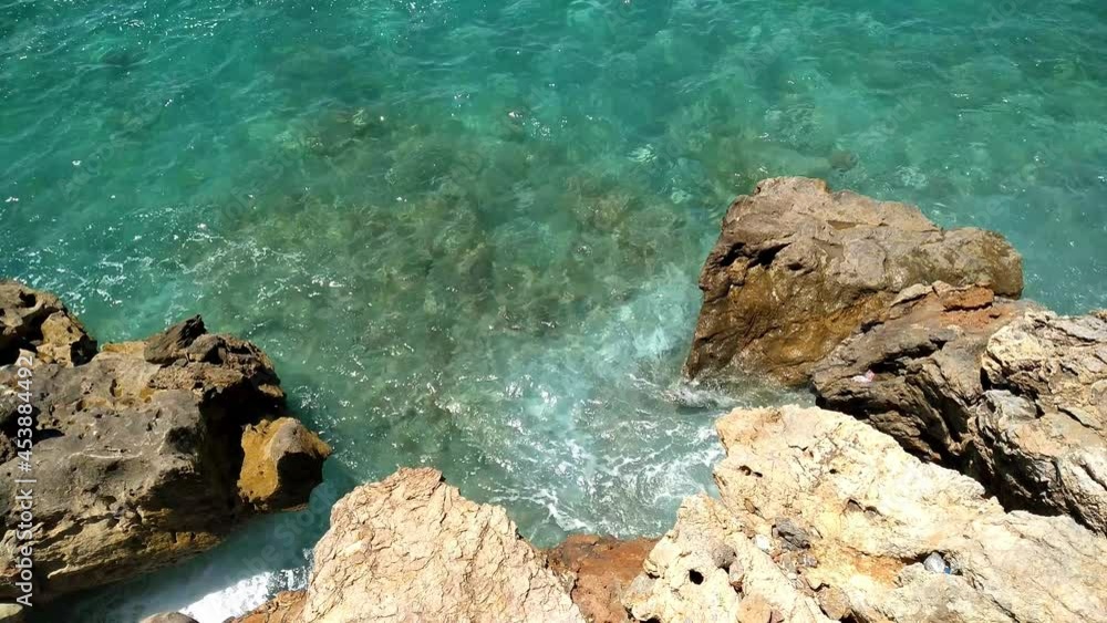 Waves splash against rocks. Marine theme with copy space. Top view ...