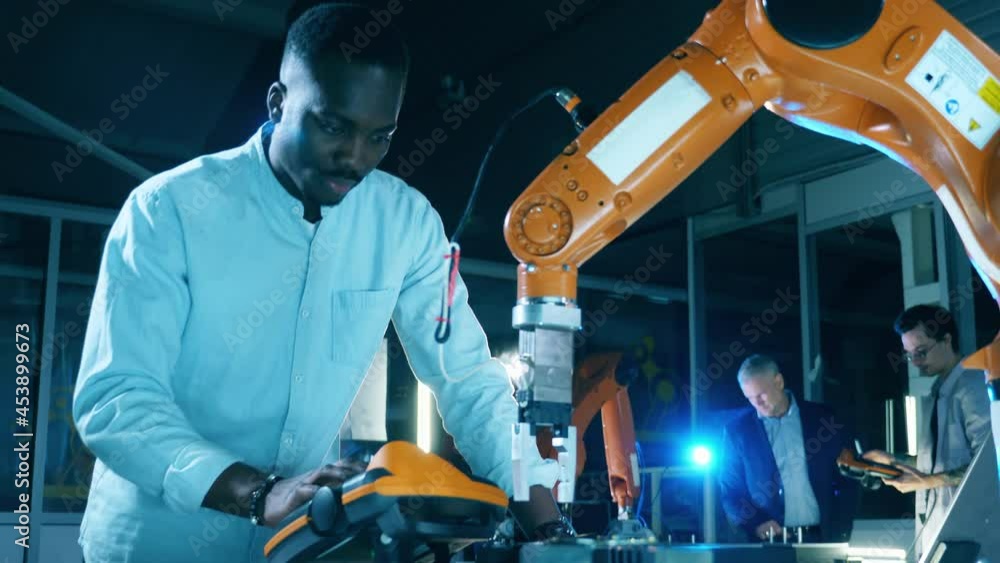 African-american engineer is studying robotic mechanism Stock Video ...