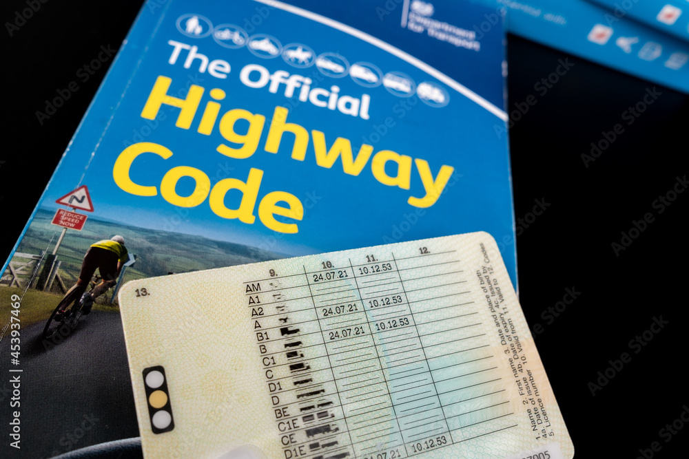 British Provisional Driving Licence on top of The Official Highway Code ...