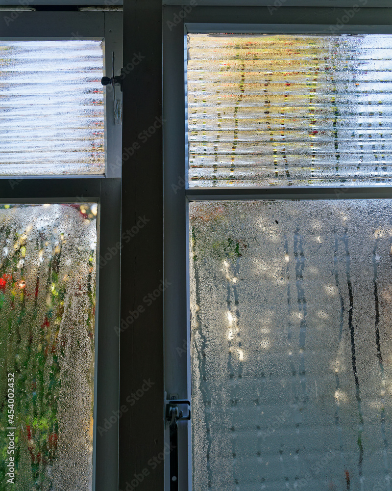 Condensation on the inside of a window in a cold damp house. Stock ...