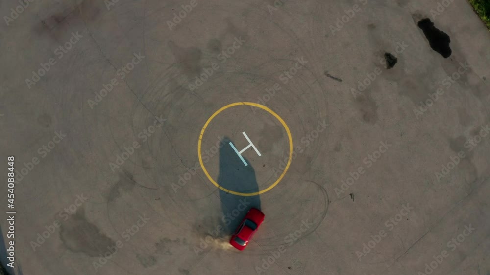 Ariel overhead shot drift sports car in a circle. Ariel overhead shot ...