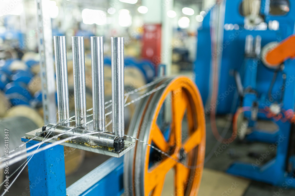 Fiber optic cable production machine, line in a factory in a workshop ...