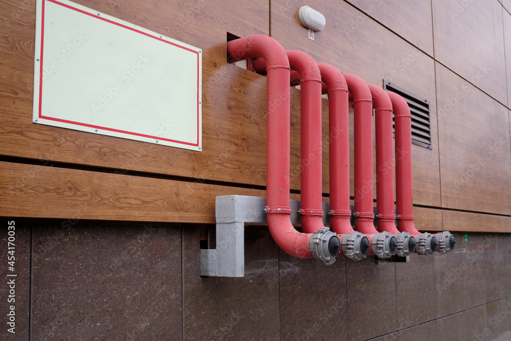 Fire hydrant beside wall for connecting to fire truck for support water ...
