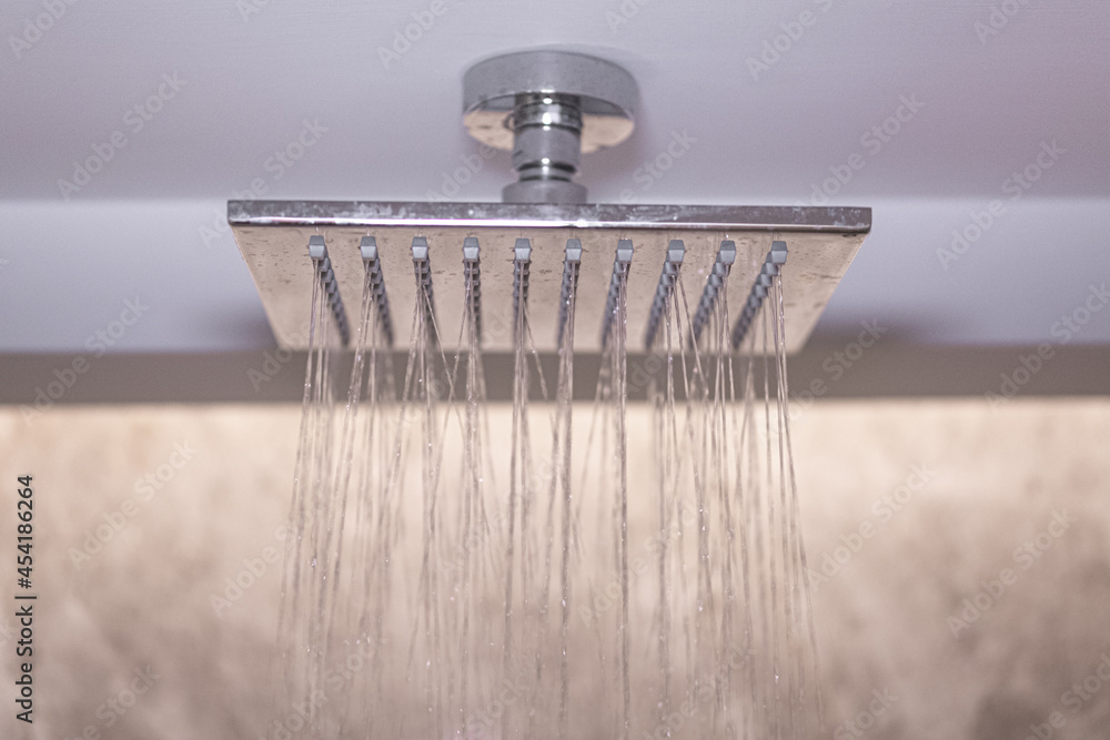 Shower turned on, overhead ceiling shower with flowing water faucet ...