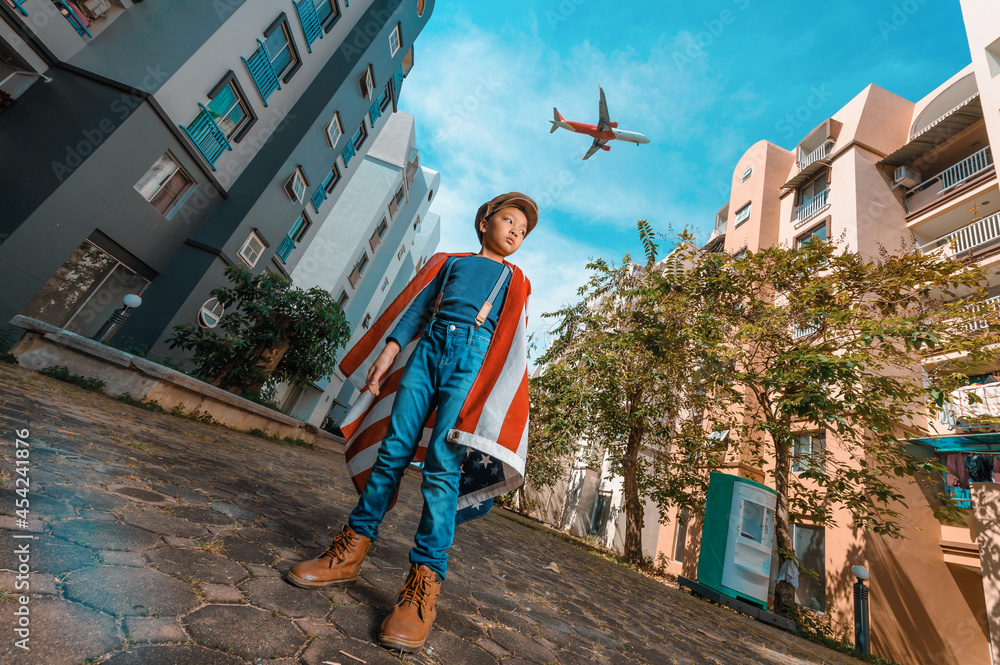 A good looking kid boy about 10years old wearing a vintage dress posing ...