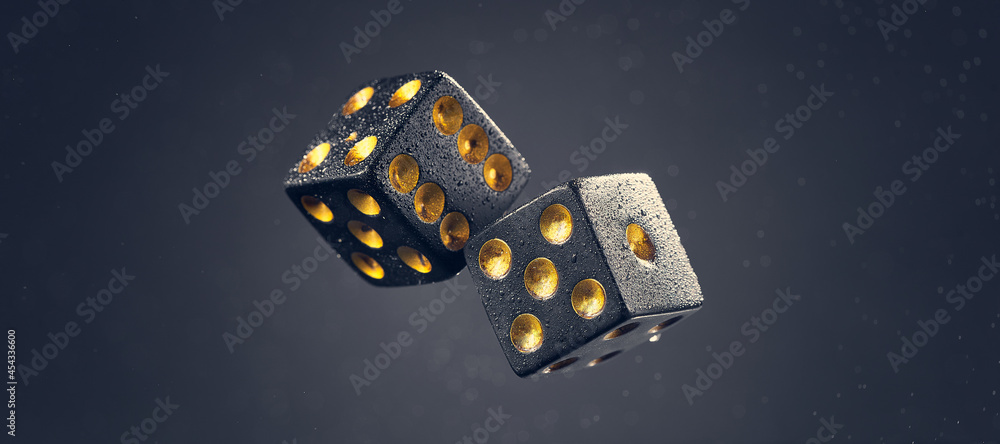 Two black dice are falling on a dark gray background. Photo with bokeh ...