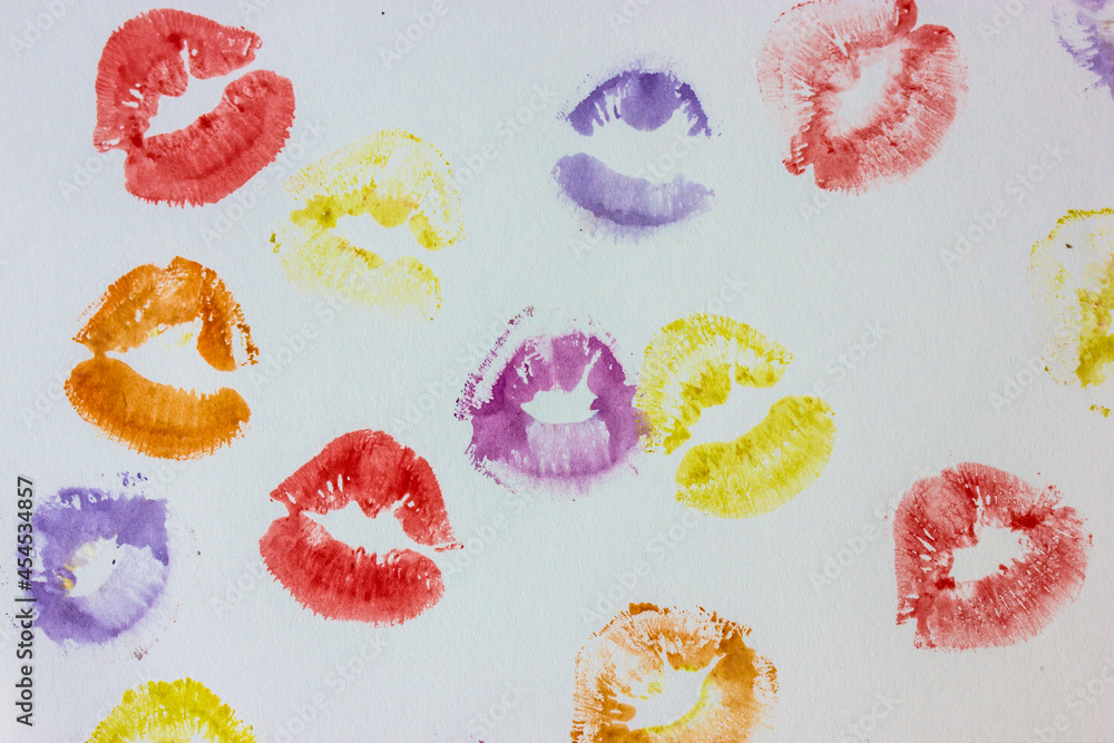 Set of multicolored female lip prints on white paper background top ...
