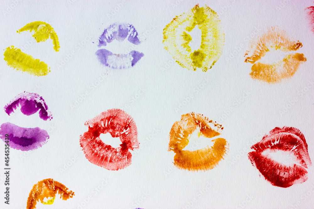 Set of multicolored female lip prints on white paper background top ...
