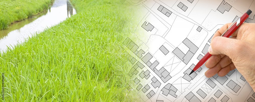 Planning a new city - concept image with hand drawing an imaginary ...