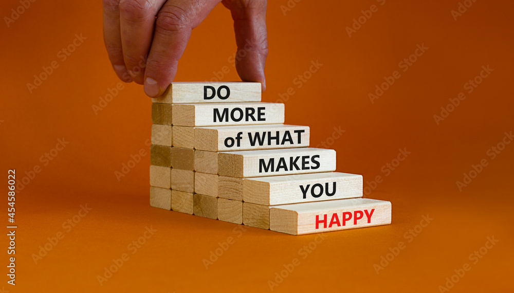 Do what makes you happy symbol. Wooden blocks with words 'Do more of ...