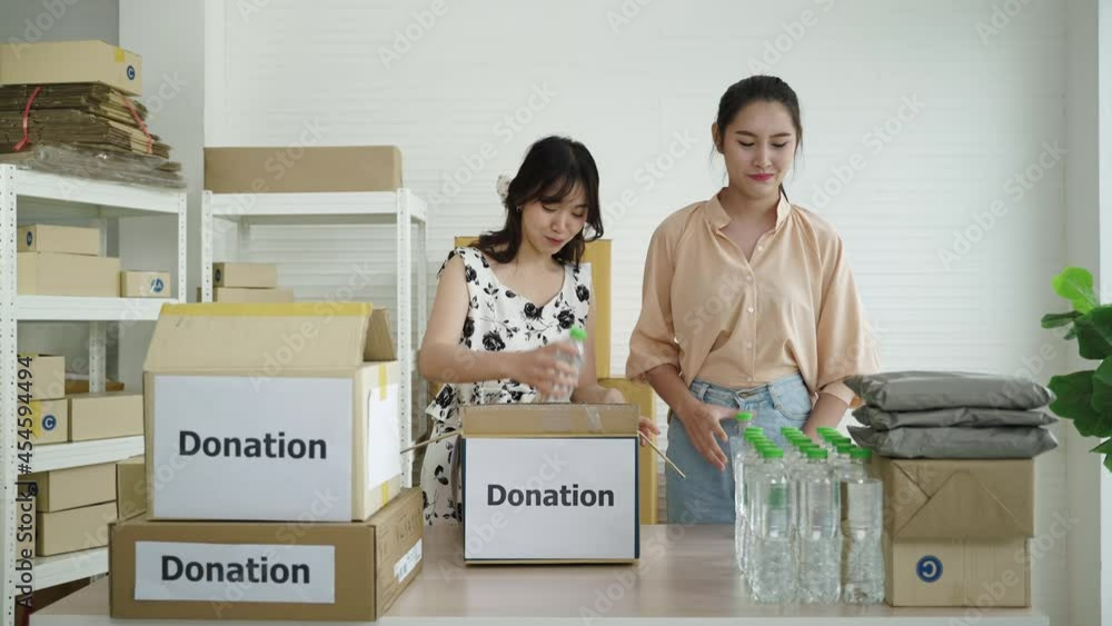 transgender woman and her female friends are packing boxes for ...