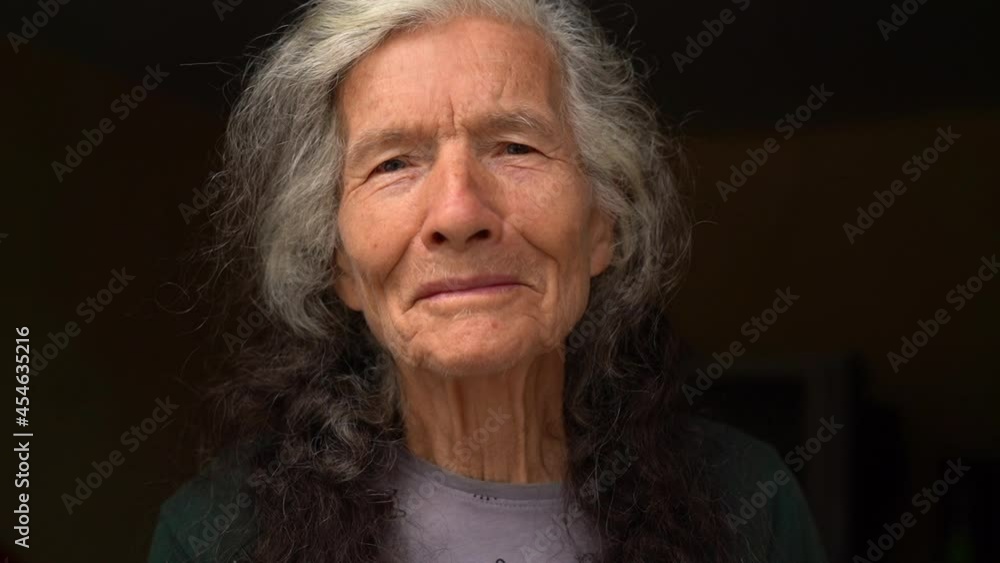 Portrait of an elderly woman 80-90 years old. Old odd lady with ...
