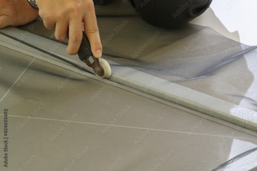 man install mosquito net wire screen on house window protection against ...