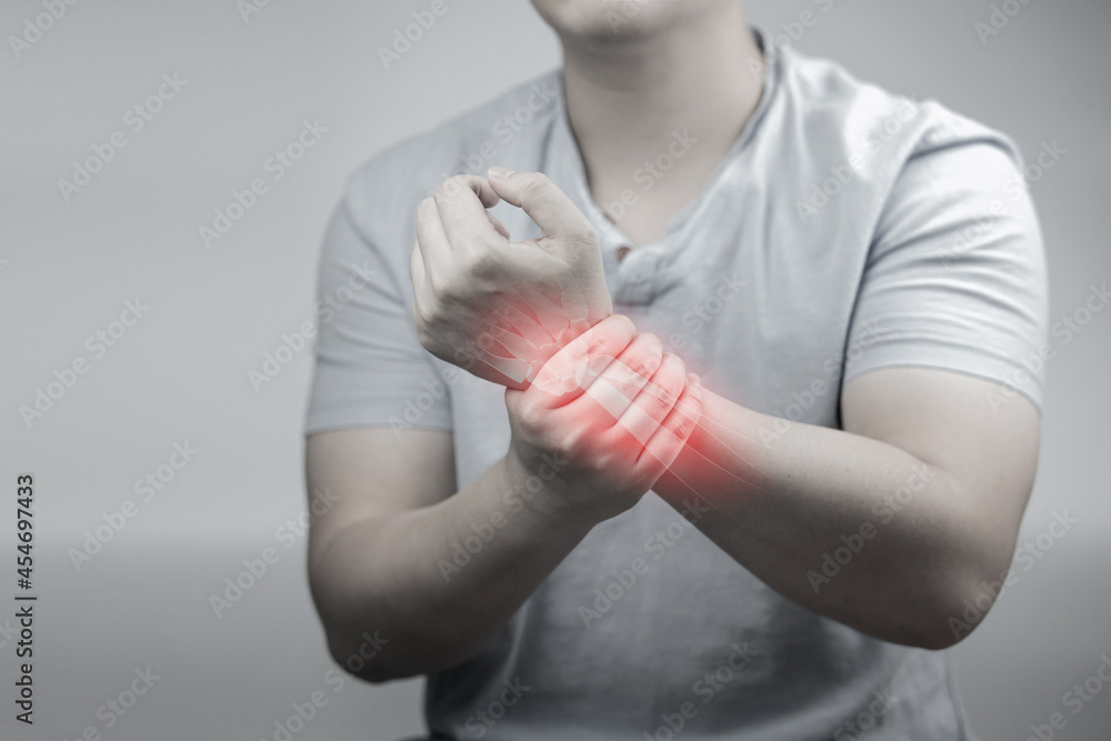 Wrist pain, myositis, muscle weakness, red zone inflammation. Man with ...