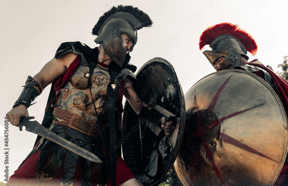 Battle with swords between two ancient warriors. Stock Photo | Adobe Stock
