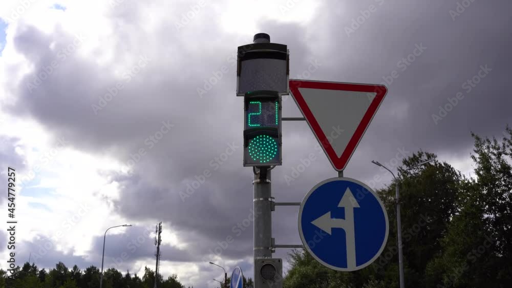 Traffic lights and road signs at a city intersection, counting down the ...