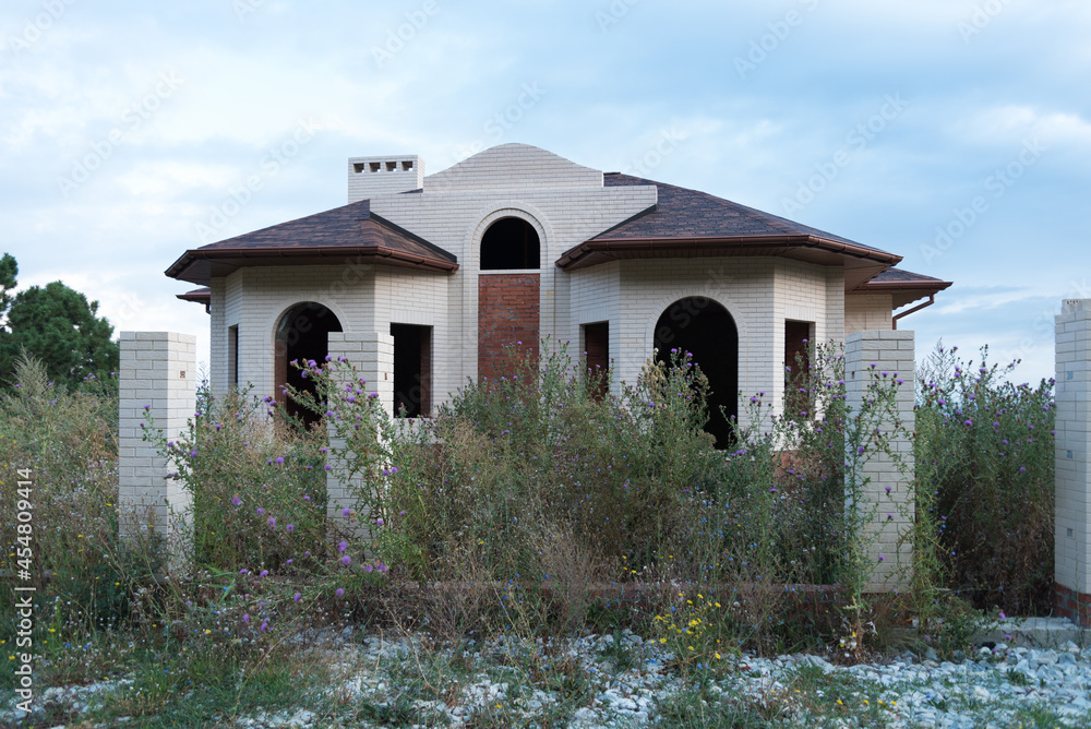 Unfinished house. Abandoned construction. House box with window ...