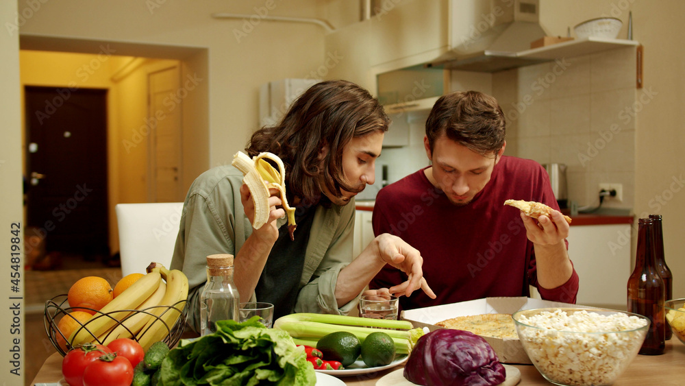 Foto de One of friend's is eating a banana and the other is eating ...