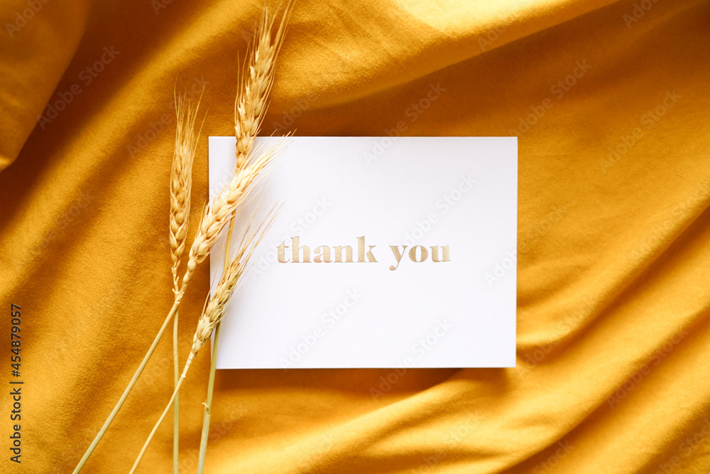 Thank you card on yellow fabric with wheat stems. Elegant minimalist ...