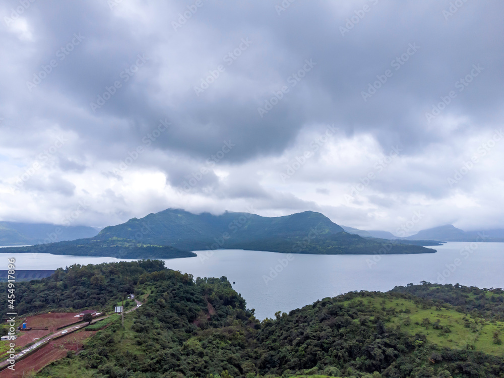 Aerial view of greenery, lake and clouds during the monsoon season at ...