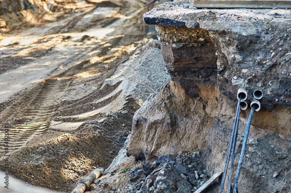Laying underground storm sewers at a construction site. Installation of ...