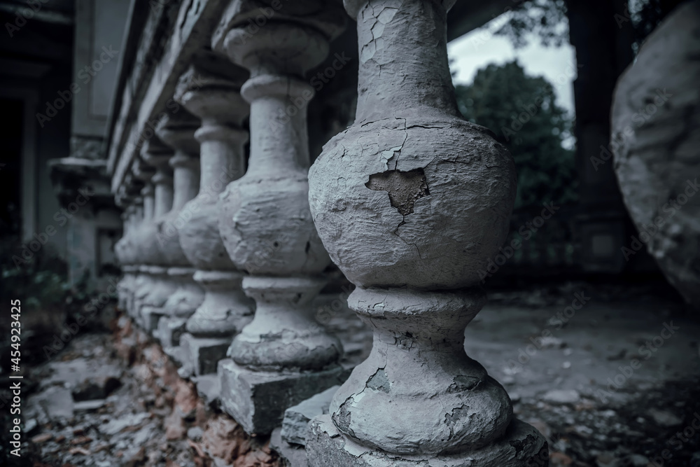 Old shabby columns in an abandoned manor. Scary haunted house. The ...