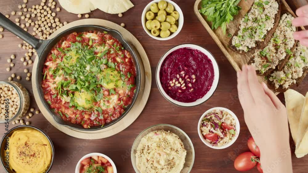 Traditional Israeli cuisine. Shakshuka in pan decorated with parsley ...