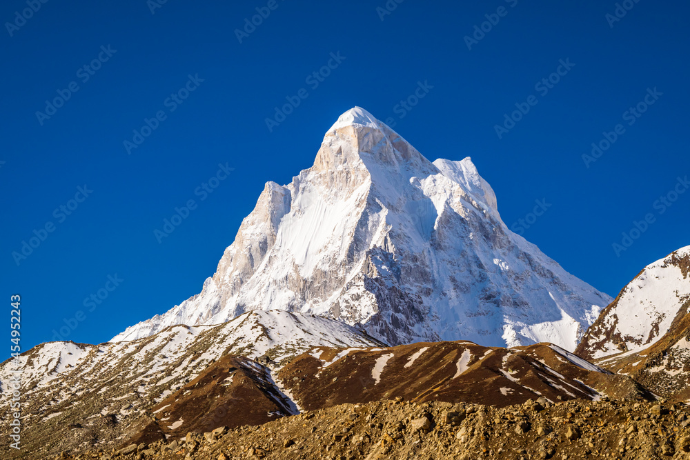 Sunrays falling on peaks of Mount Shivling during sunrise from Bhojbasa ...