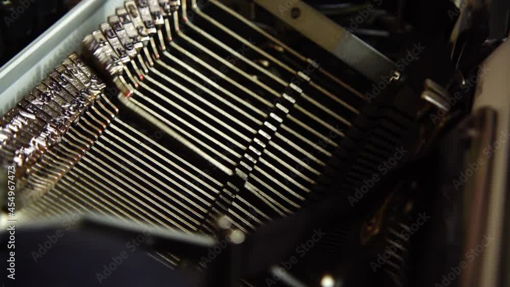 Mechanism of a retro typewriter. Old typewriter hammers. Slow motion ...