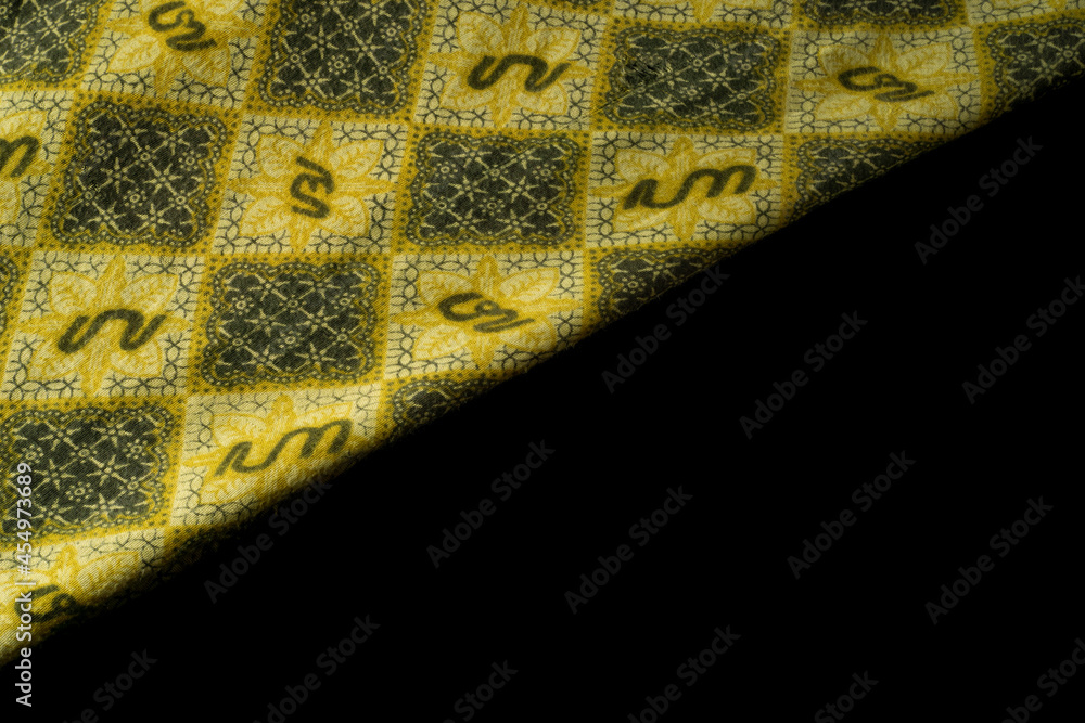 Close up photo of yellow and brown batik, traditional clothing art ...