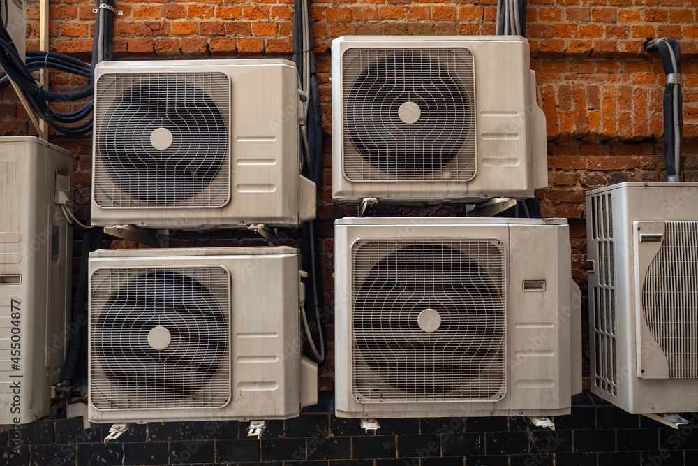 External blocks of air conditioners. Cooling system blocks on brick ...