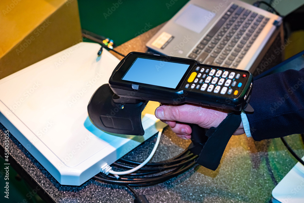 Data collection terminal. Data collection terminal in hand. Terminal is ...