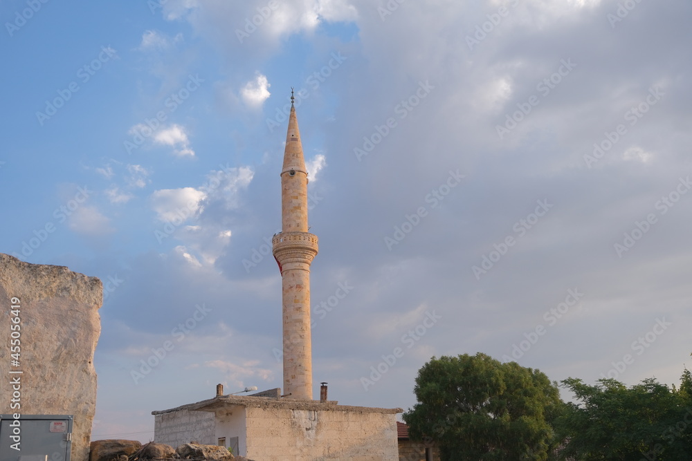 A minaret of a small masjid and mosque made of limestone in cappadocia ...